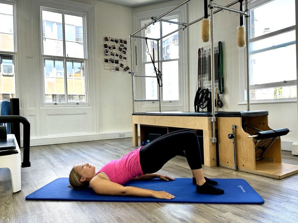 Pilates Bridge Exercise for a Stronger Back and Glutes - Complete Pilates