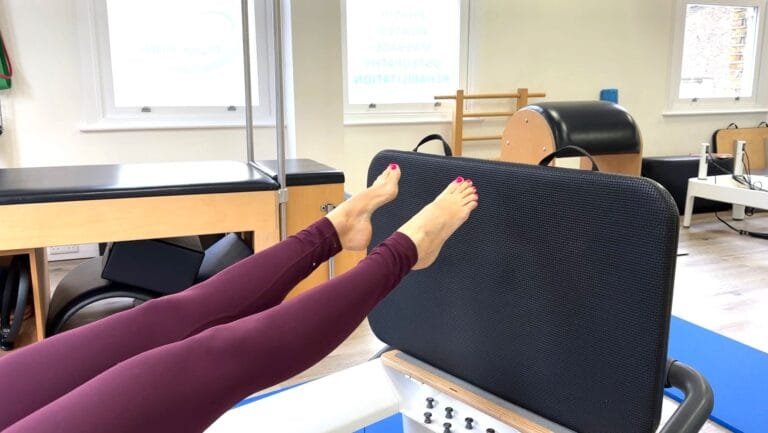 Pilates Footwork Exercise Using The Reformer Machine Positions